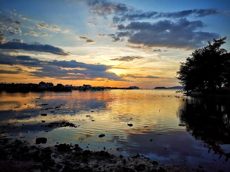 Sunset stock photo. Image of golden, reflection, sunset - 128598982