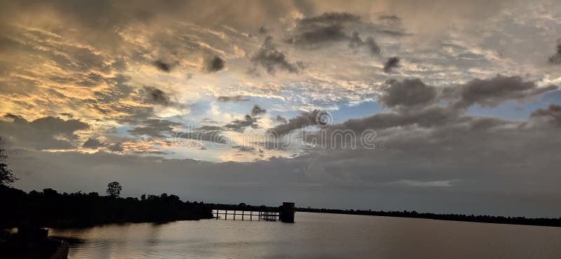 Sunset beauty at dam stock image. Image of sunset, cloud - 188630791