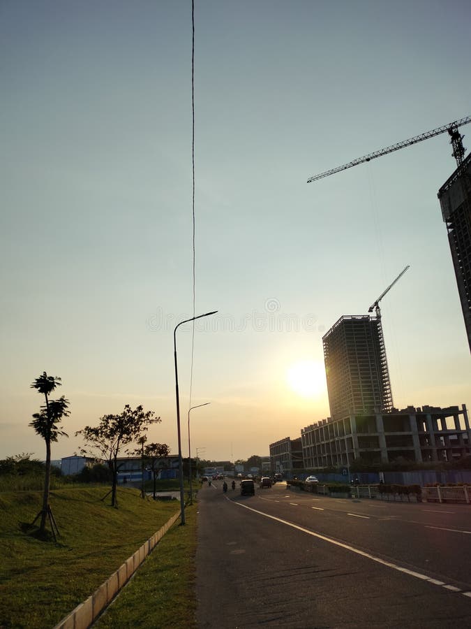 Sunset Behind Building Construction when You through the Road Stock ...