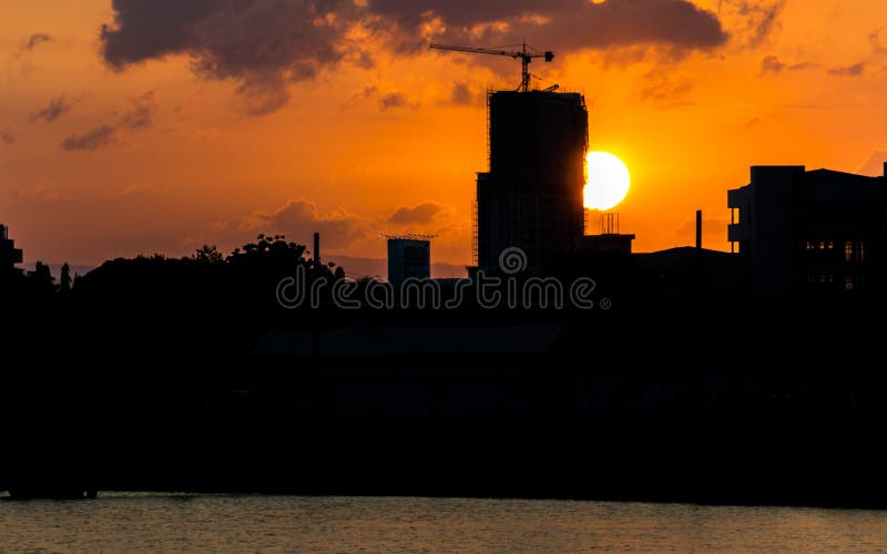 Sunset Behind a Building Under Construction. Stock Photo - Image of ...
