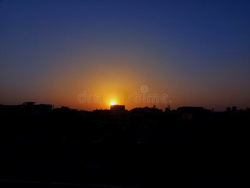 Sunset Behind the Buildings Filled with Organe and Blue Colur Stock ...
