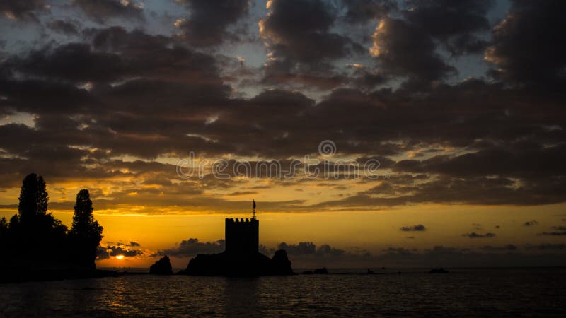Sunset Behind a Castle Under a Sky Full Covered by Clouds Stock Photo ...