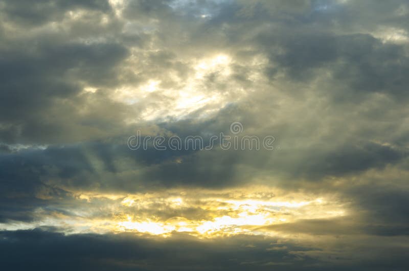 Sunset Behind the Clouds Light Beams through the Rain Clouds a Warm ...