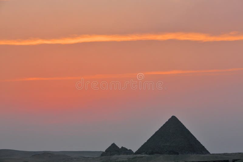 Sunset Behind Distant Egyptian Pyramids Stock Photo - Image of ...
