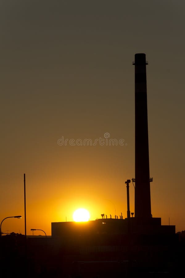 Sunset Behind a Factory Chimney Stock Image - Image of towering ...
