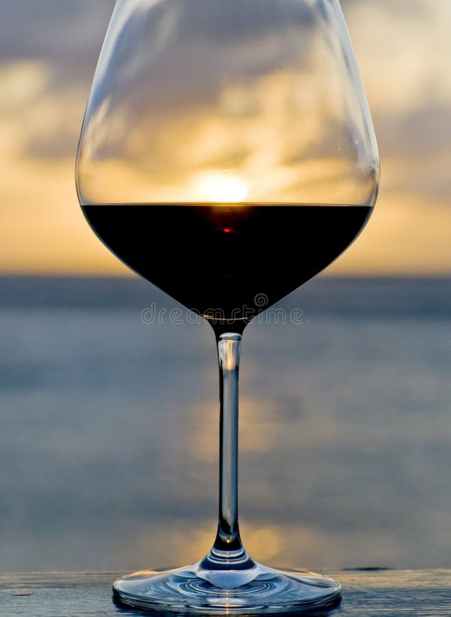 Red wine glass at sunset stock photo. Image of golden - 29604546
