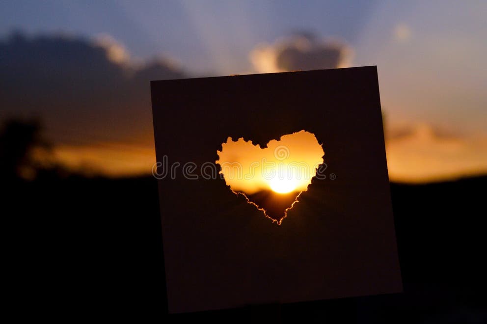Sunset Behind a Heart Shaped Paper Stock Photo - Image of passion ...