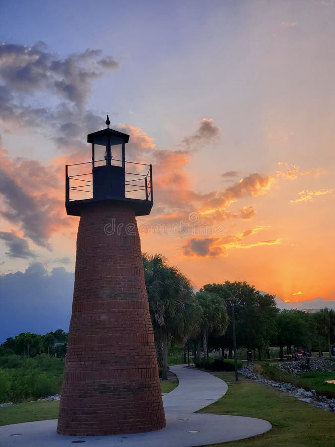 Sunset Behind Lighthouse at Lakefront Park Stock Image - Image of ...