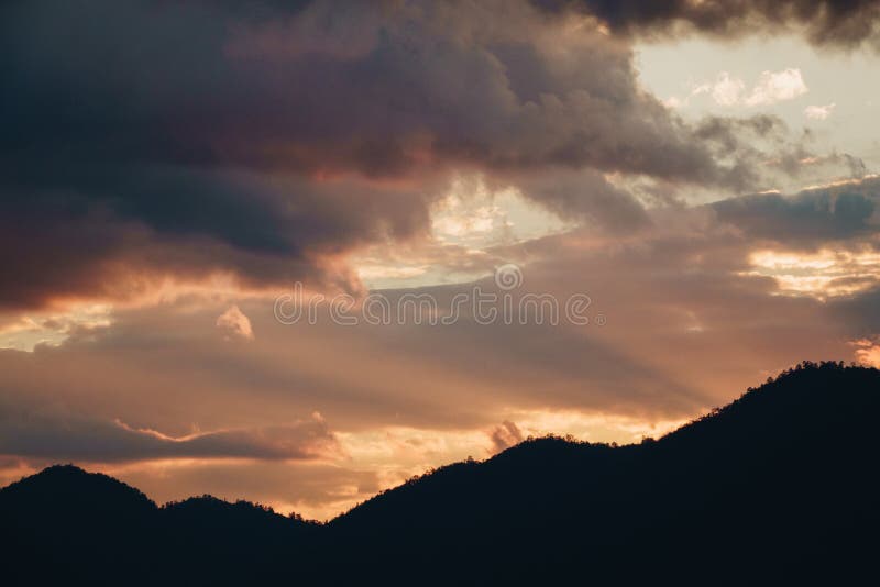 Sunset Behind Mountain stock photo. Image of background - 83953282
