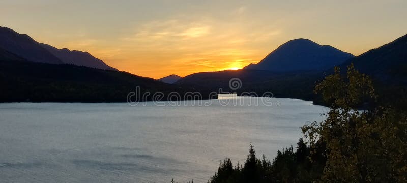 Sunset behind mountain stock image. Image of dusk, cloud - 231477063