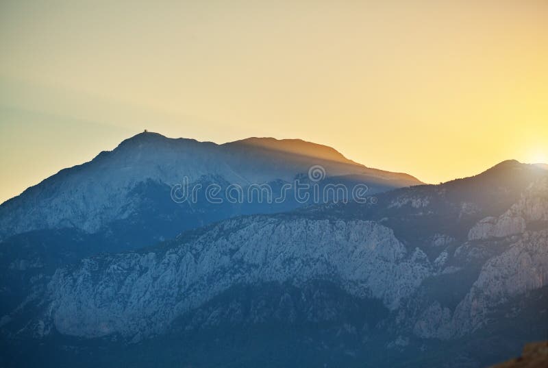 Sunset behind mountains stock photo. Image of panoramic - 28650718