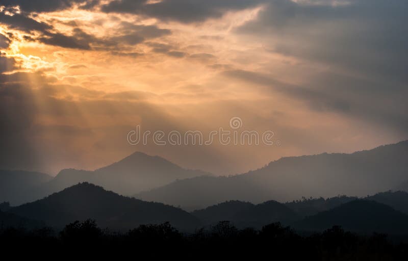 Sunset Behind the Mountains Stock Image - Image of mountains, evening ...