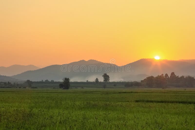 Sunset behind mountains stock photo. Image of back, land - 49725442