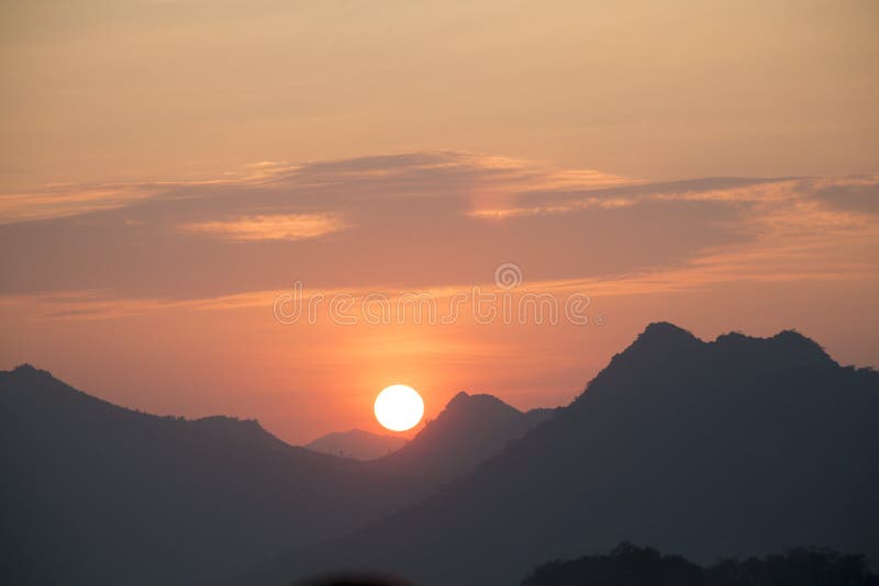 Sunset Dipping Behind Mountains Stock Image - Image of blue, light ...