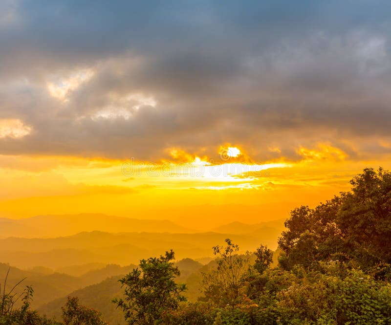 Sunset behind mountains stock image. Image of brightly - 39003067