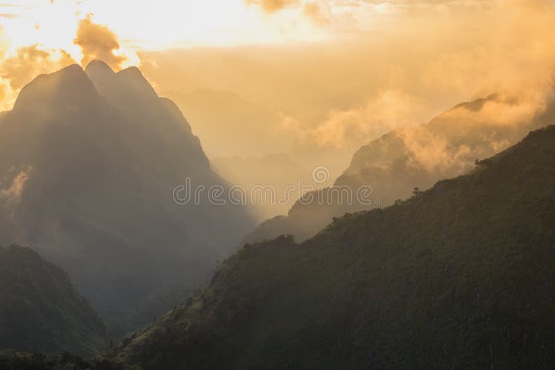 Sunset behind mountains stock photo. Image of mountains - 49324430