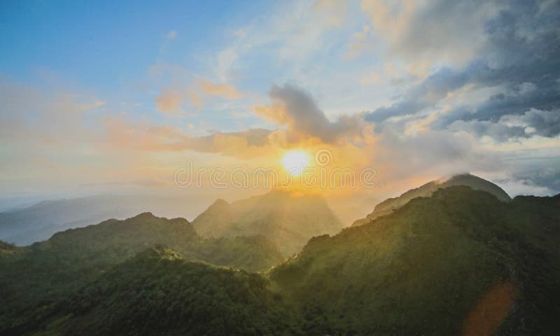 Sunset behind mountains stock image. Image of copy, bright - 49324429