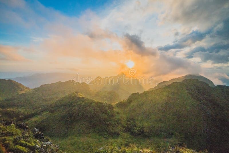 Sunset behind mountains stock image. Image of copy, bright - 49324429