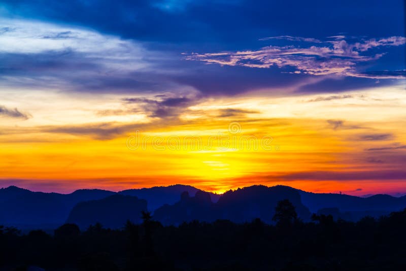 Sunset Behind the Mountains and Twilight Stock Image - Image of yellow ...
