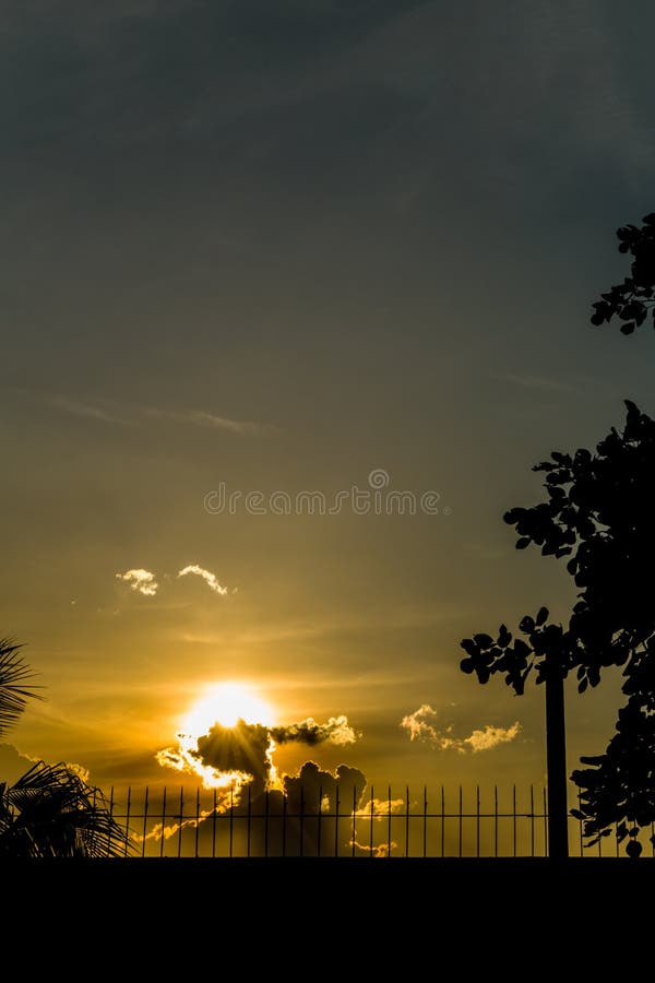 Sunset Behind Prison Wall stock image. Image of silhouette - 61687817