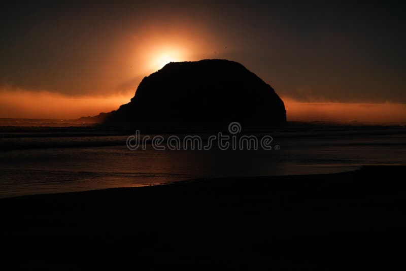 Sunset behind the rock stock image. Image of sand, coast - 57202131