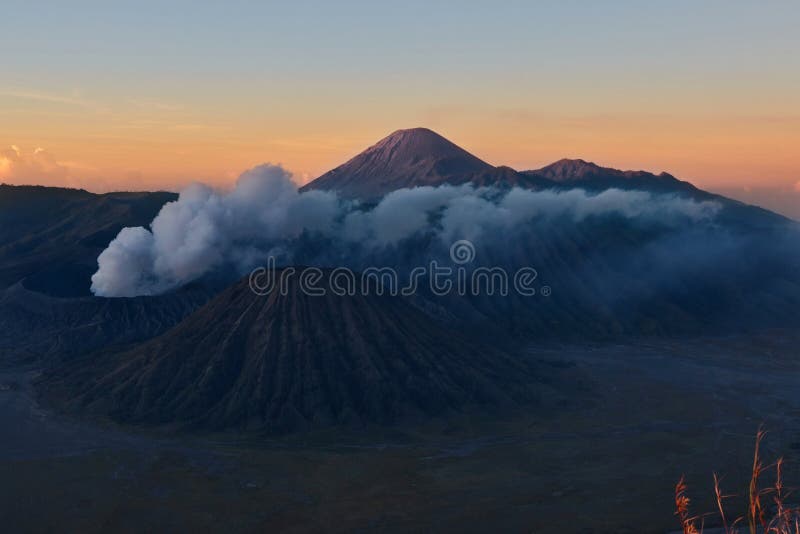Sunset Behind Smoky Volcano Mountain, Indonesia Stock Photo - Image of ...