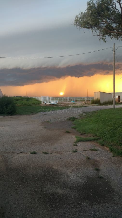 Sunset behind storm clouds stock image. Image of sunset - 125199991