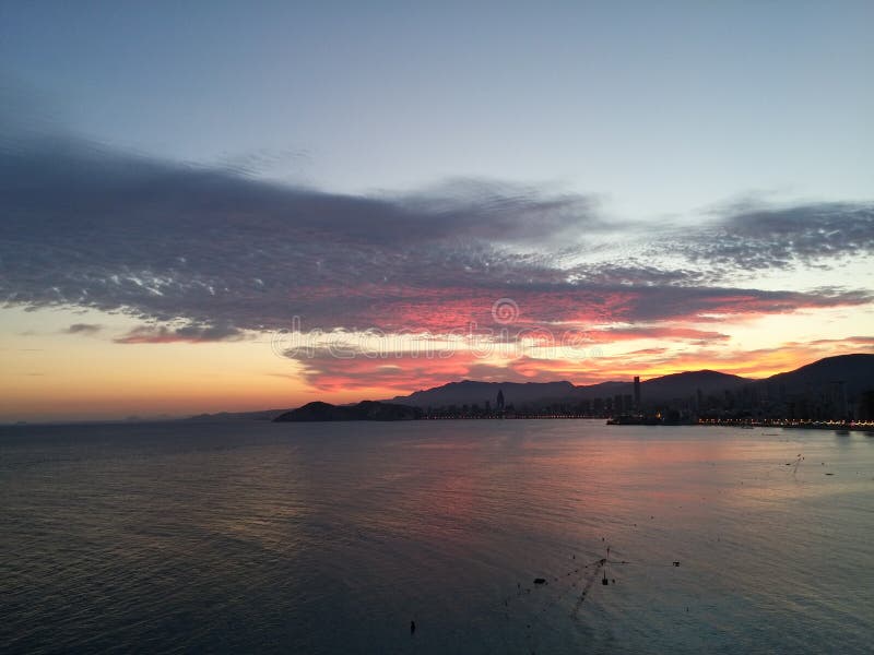 Sunset in Benidorm, Spain stock image. Image of silhouette - 66906929