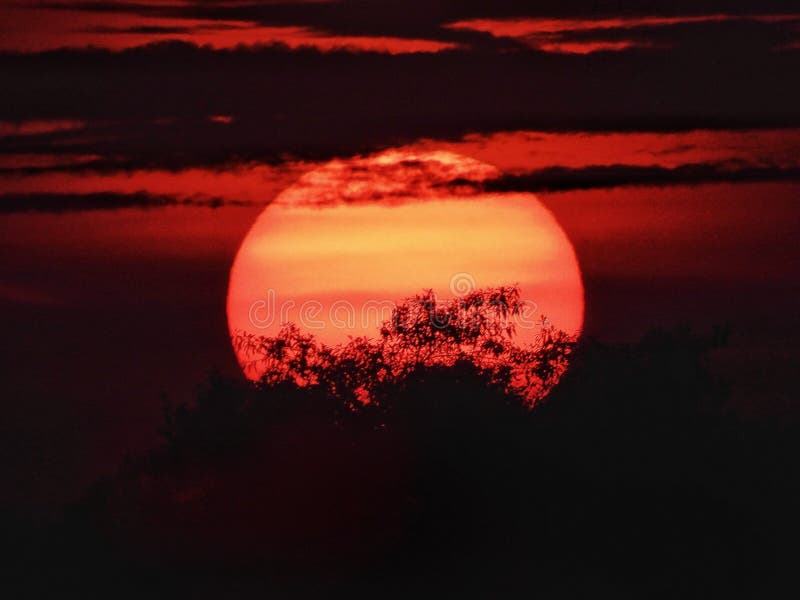 Sunset with a big sun stock image. Image of clouds, tropical - 175895767