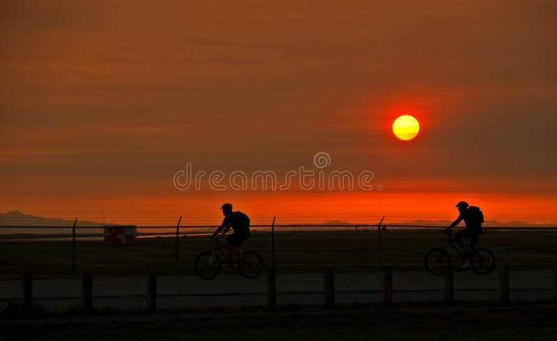 Sunset Bike Riders stock photo. Image of mountainbike - 11244608