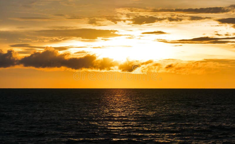 Sunset in Bintuni Gulf stock image. Image of setting - 133374181