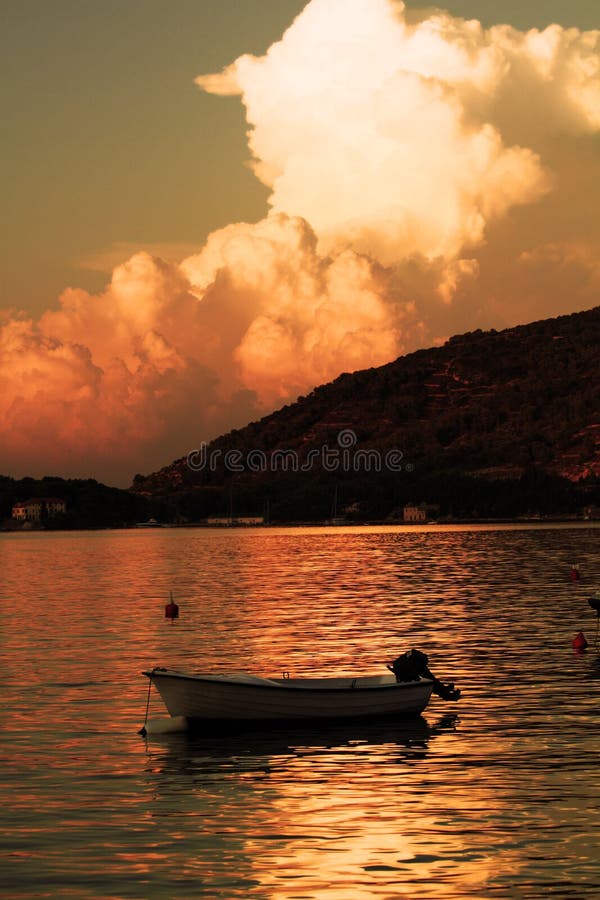 Sunset with boat stock photo. Image of mountain, boat - 25117852