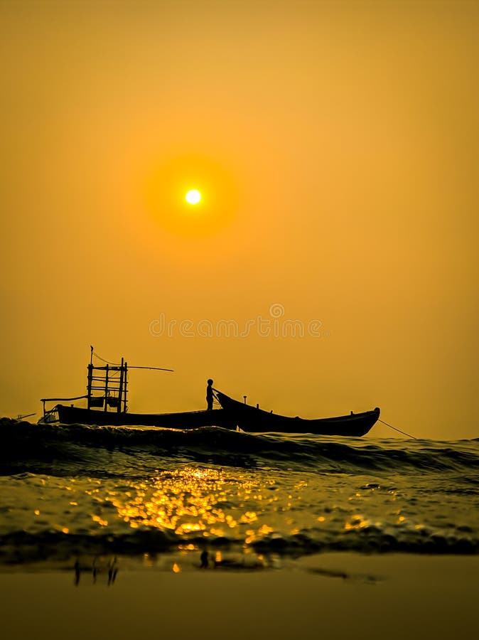 Sunset and the Boat with a Little Boy in a Frame and the Ocean Stock ...