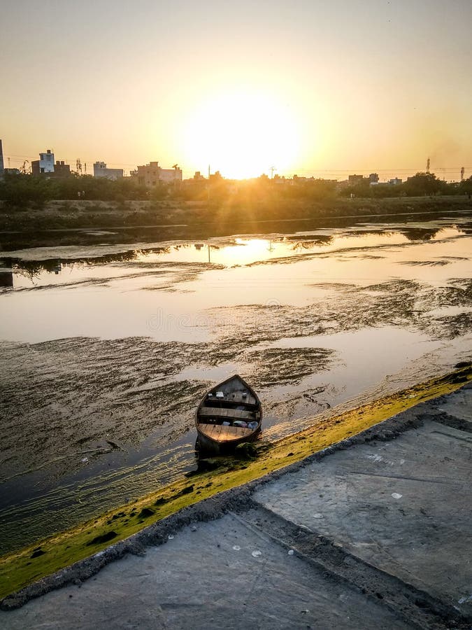 Sunset at boat stock photo. Image of horizon, boat, water - 245608062