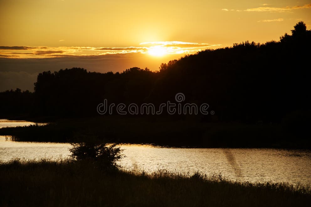 Sunset on the Border of the Lake Stock Photo - Image of lake, yellow ...