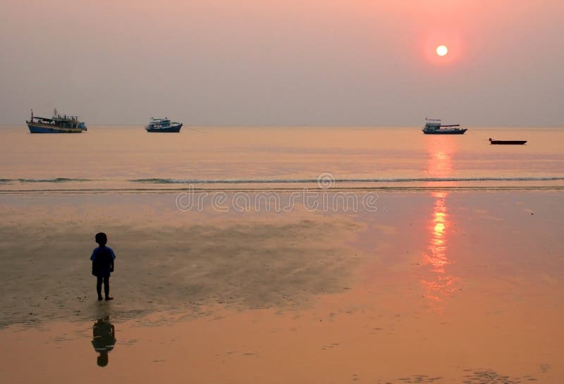 Sunset with boy stock photo. Image of beautiful, island - 16379104