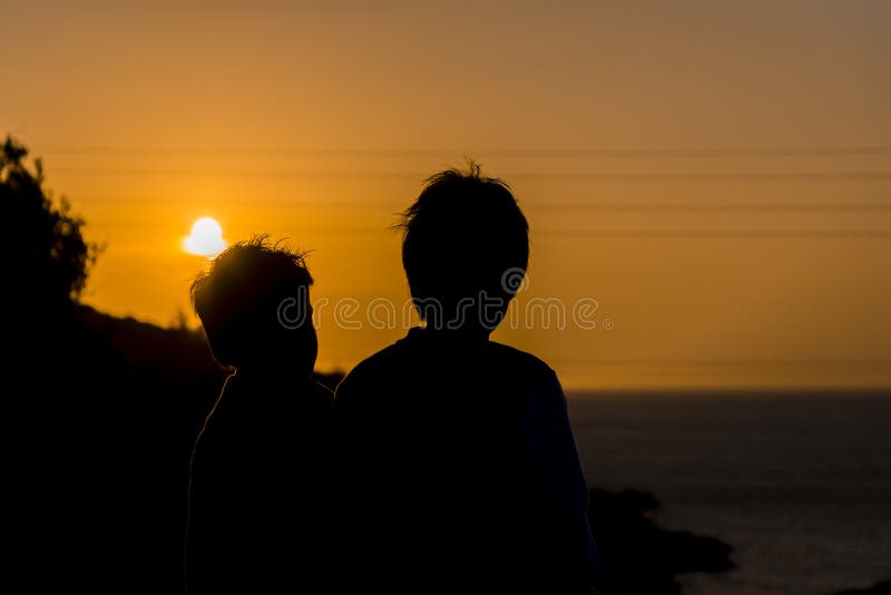 Sunset boys stock photo. Image of silhouette, shore, ocean - 32641692