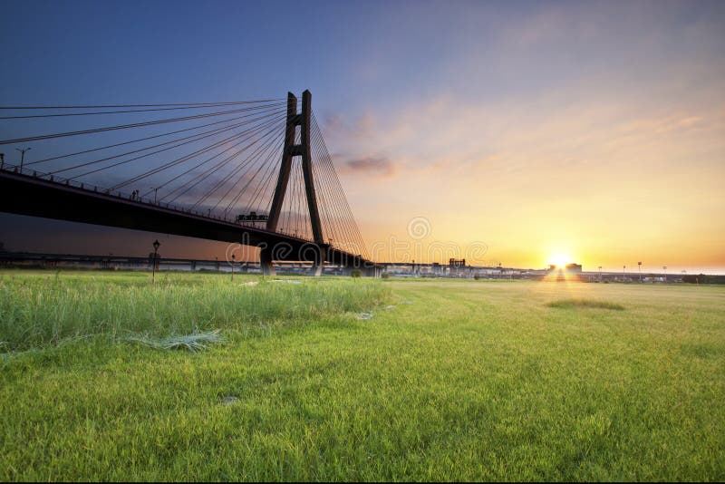 Sunset with bridge stock photo. Image of reflection, ocean - 25765978