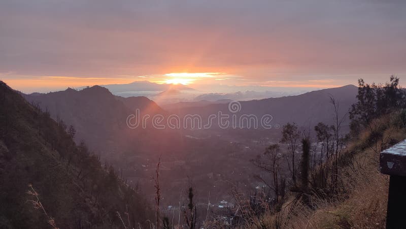 Sunset at Bromo:s mountain stock image. Image of mist - 377300839