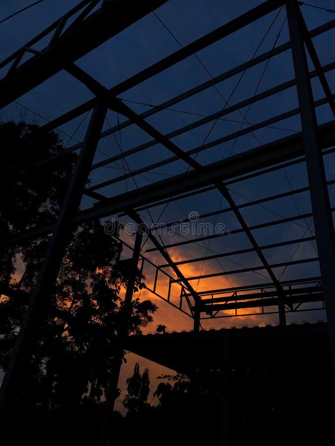 Sunset and building stock photo. Image of yellow, beutiful - 222041764