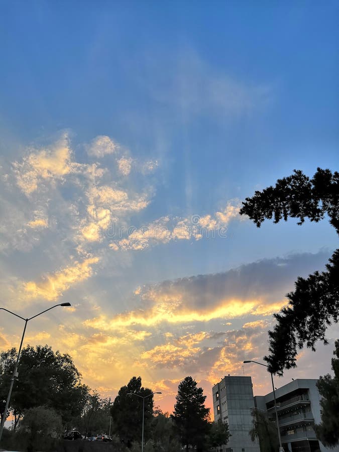 Sunset with Buildings and Clouds Stock Photo - Image of university ...