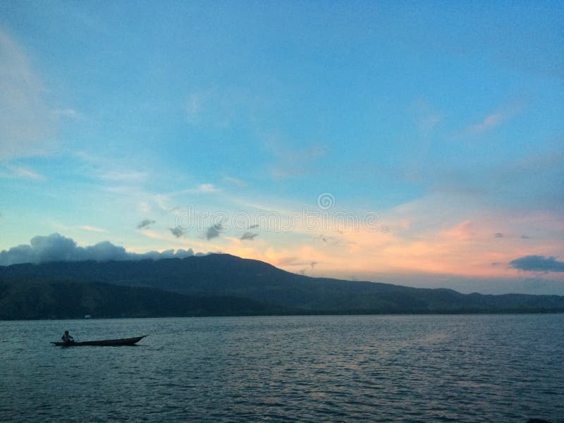 Sunset stock image. Image of papua, sentani, lake, canoe - 92828617