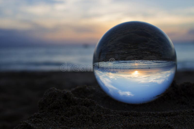 Sunset Captured in Glass or Crystal Ball on Beach Stock Image - Image ...