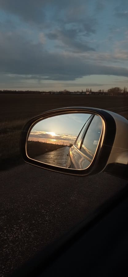 Sunset in the car mirror stock image. Image of sunset - 226644085