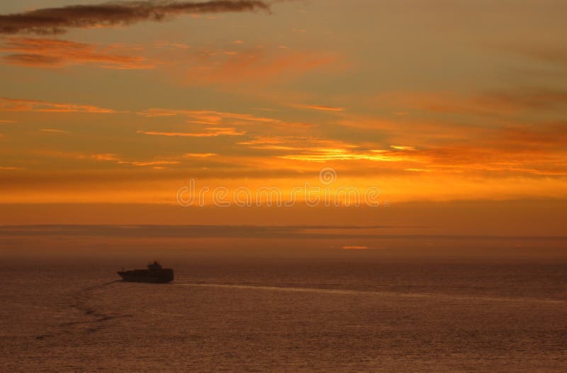 Sunset and cargo ship stock image. Image of intermodal - 2418741