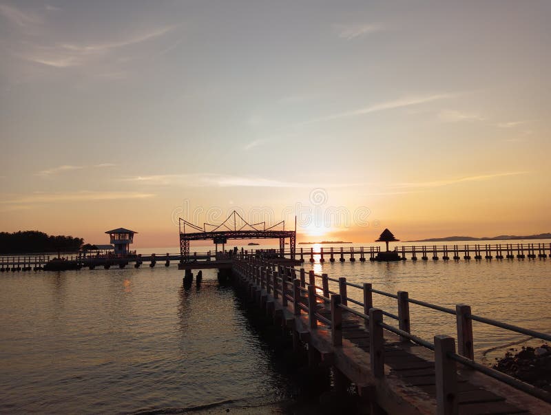 Sunset in Carocok Painan Beach Stock Photo - Image of horizon, pier ...