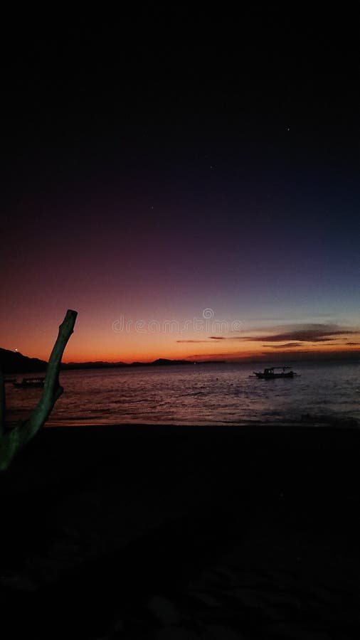 Sunset in cemare beach stock image. Image of sunset - 248914341