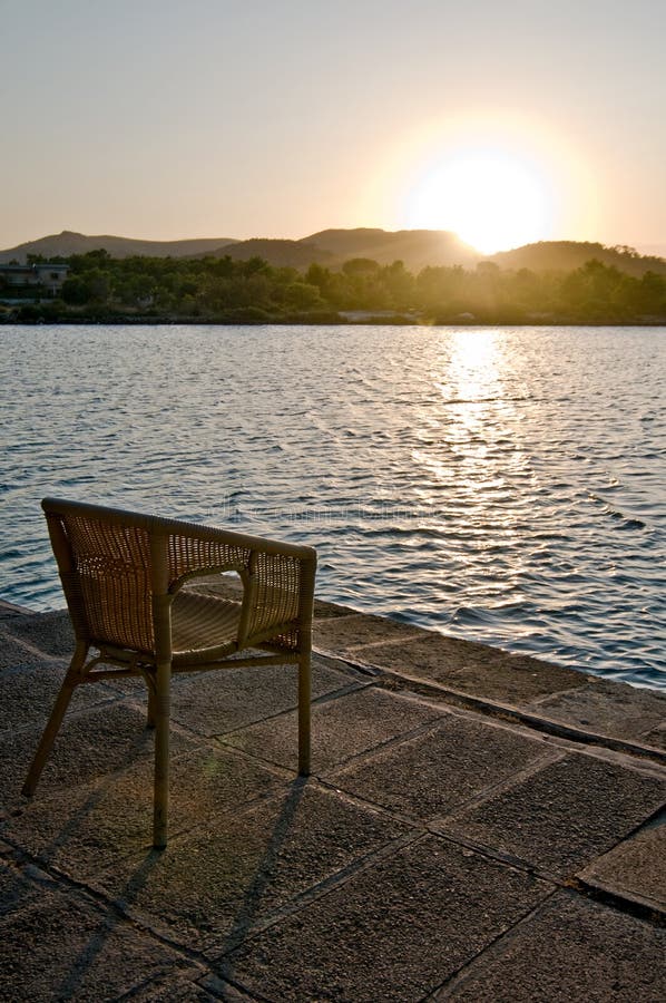 Sunset Chair stock photo. Image of clouds, water, tropical - 942760