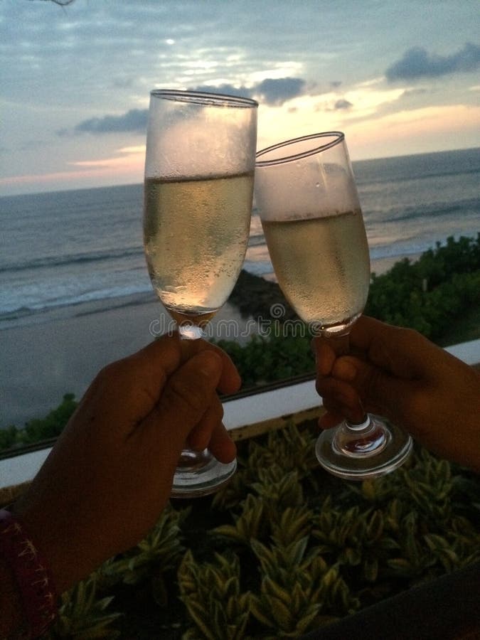 Sunset cheers stock photo. Image of cheers, sunset, love - 77567736