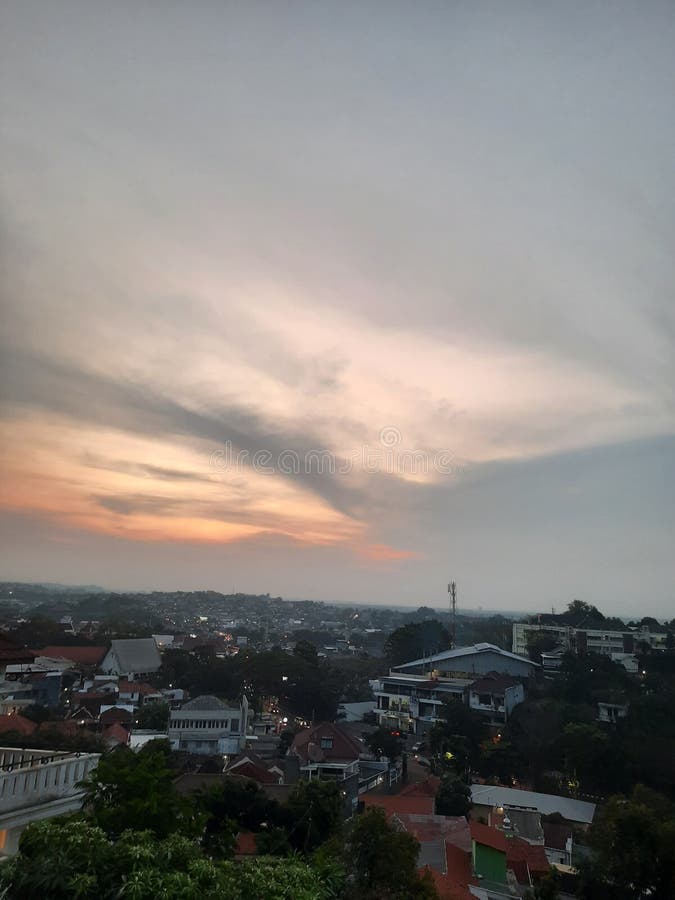 Sunset and City Light in Little Bit Cloudy Season Stock Image - Image of cloudy, light: 266007923